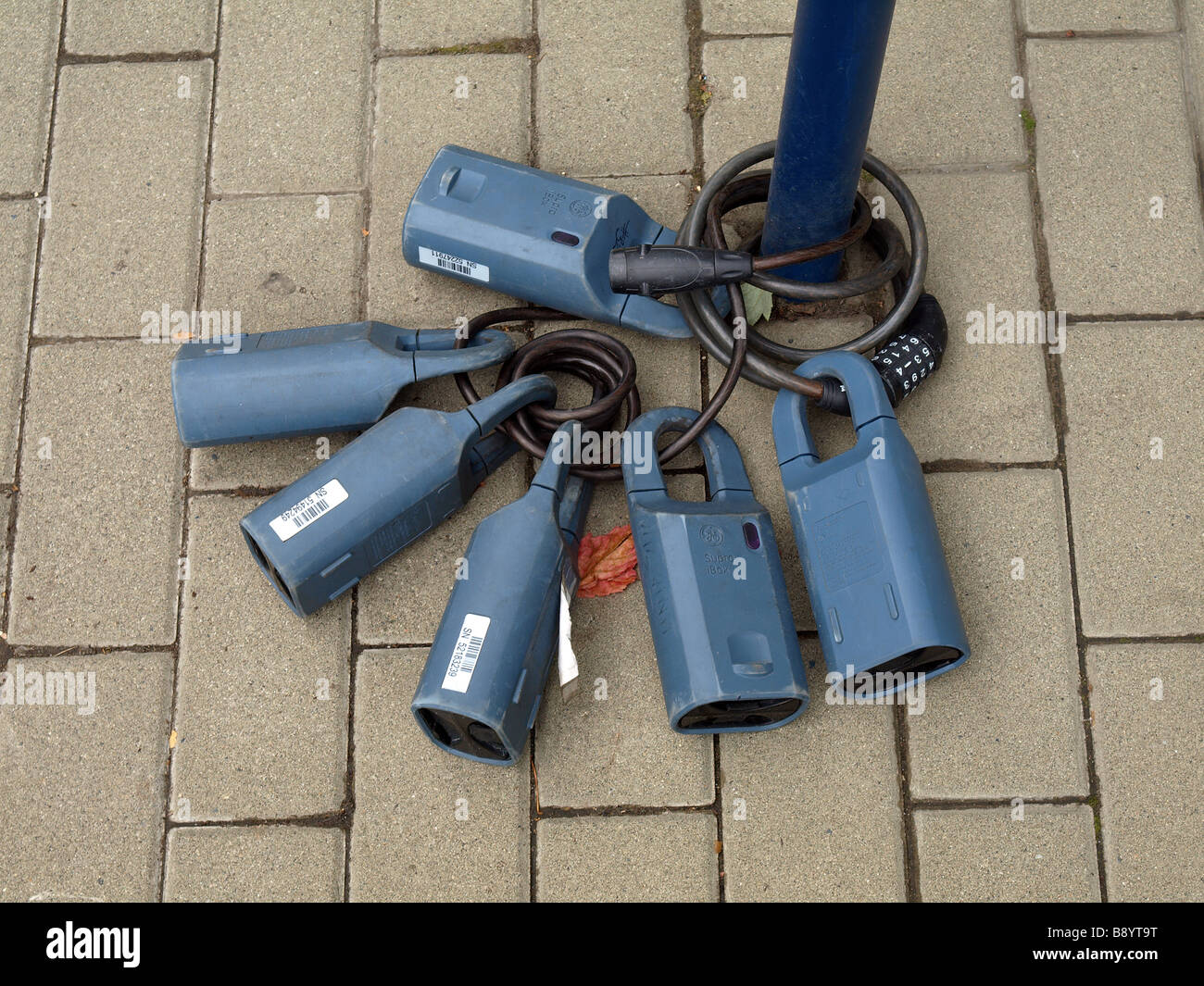 Electronic lockboxes attached to a cable in front of a newly ...