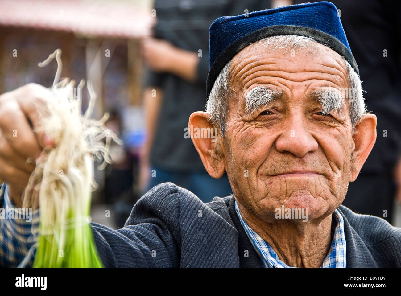Old man selling vegetables in a market, Uzbekistan Stock Photo - Alamy
