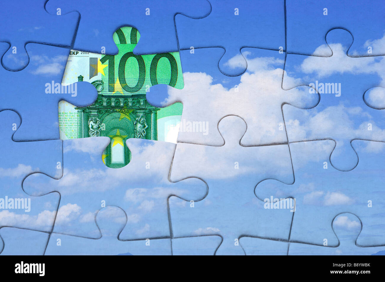Paper money under a jigsaw puzzle of clear sky pattern Stock Photo - Alamy