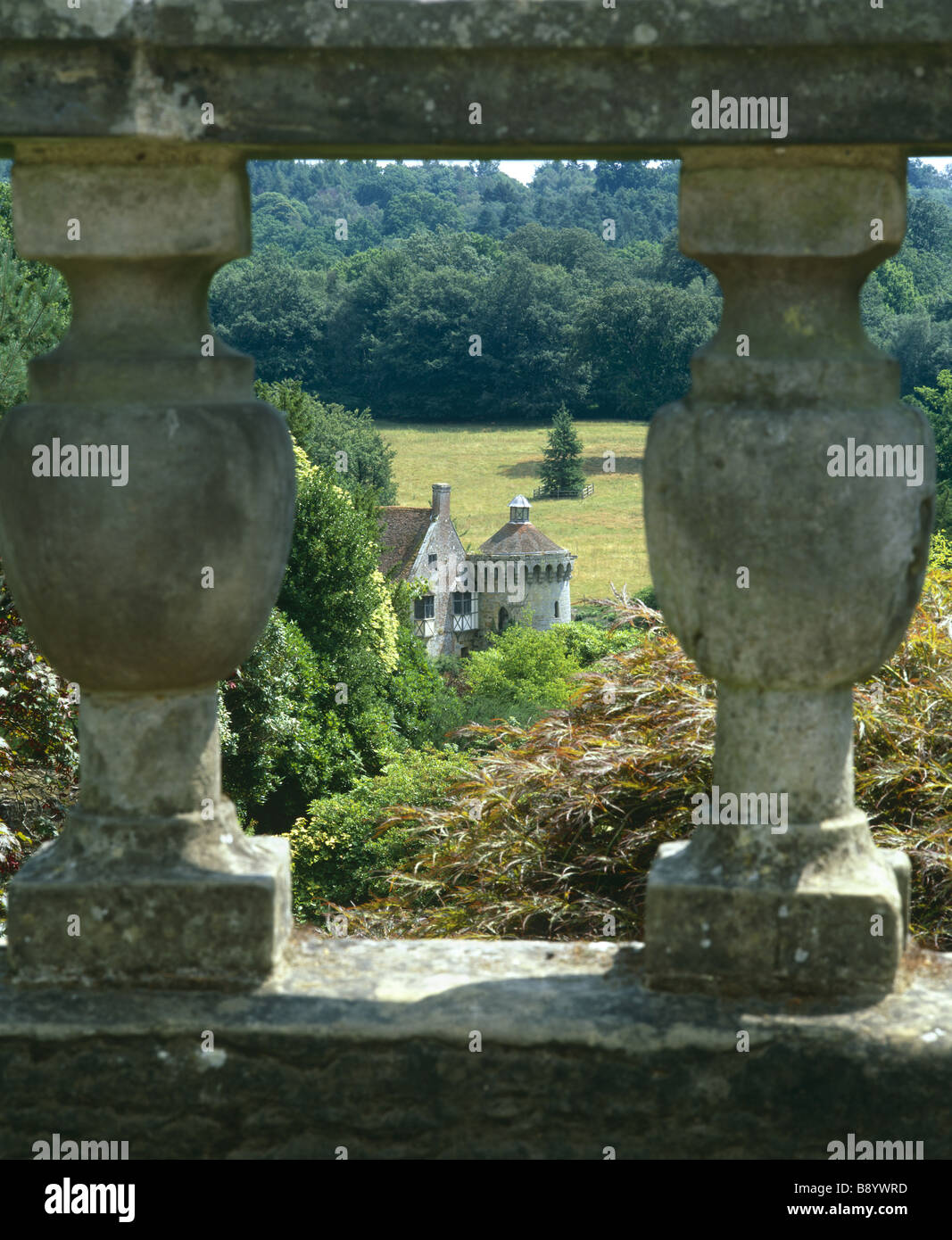 The C14th moated old castle viewed from the bastion at Scotney Castle ...
