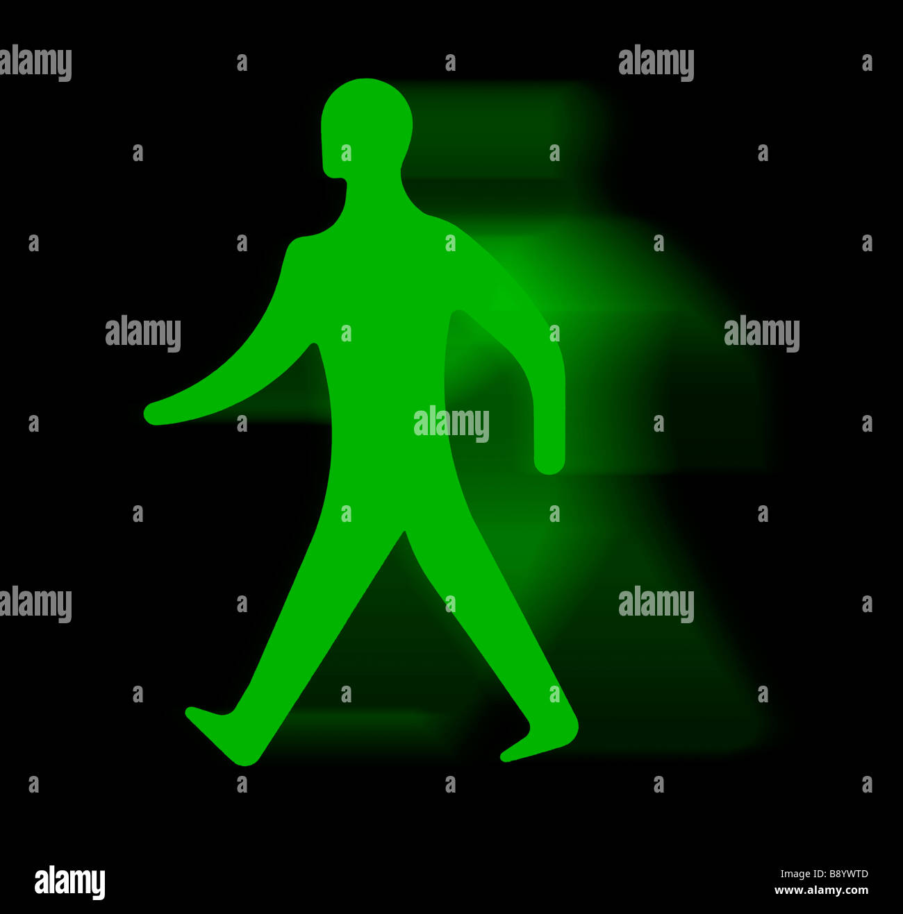 Green man walk sign from a pedestrian crossing with motion blur. Heaton ...