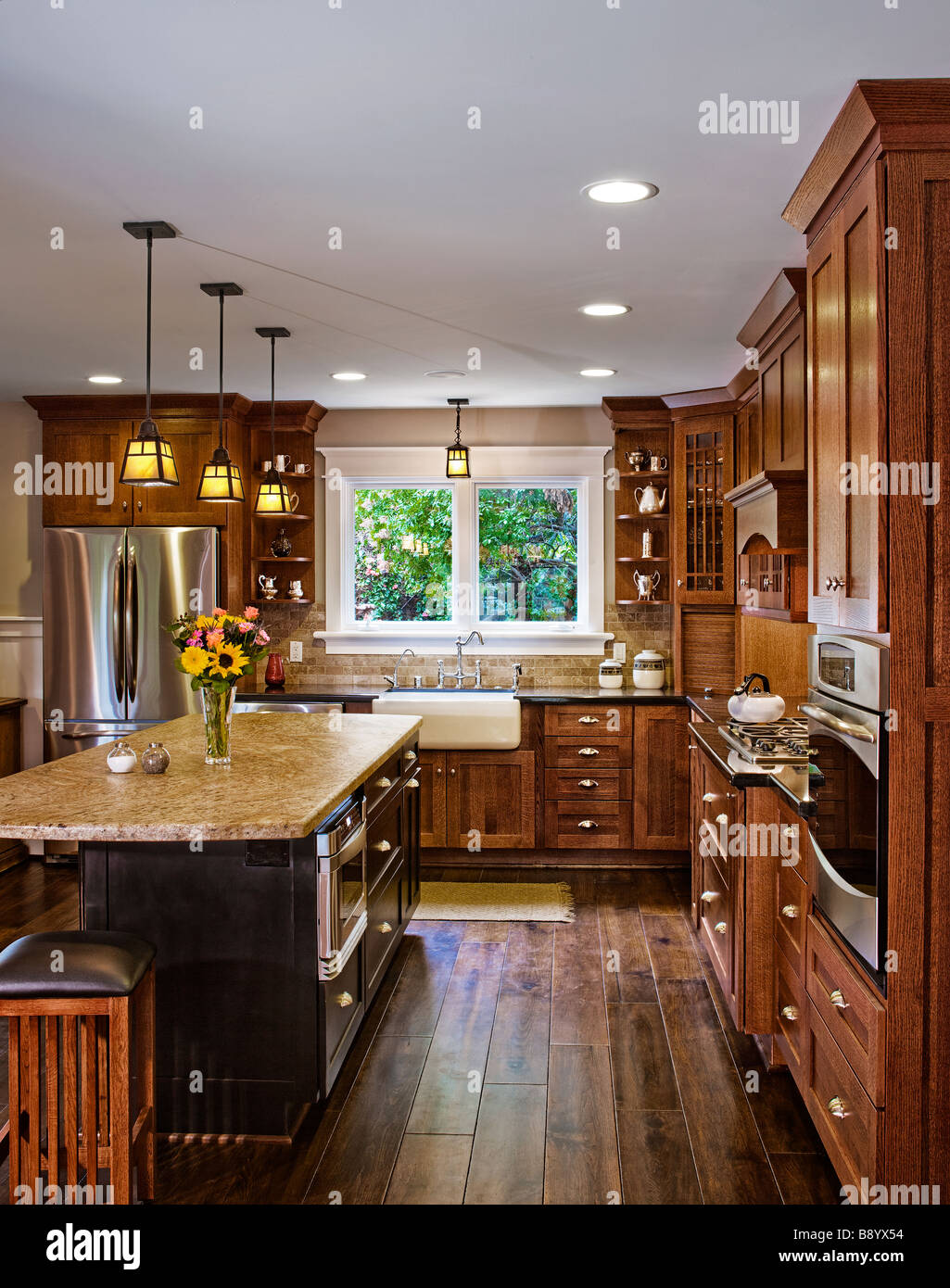 Hardwood floors and cabinets in kitchen Stock Photo - Alamy