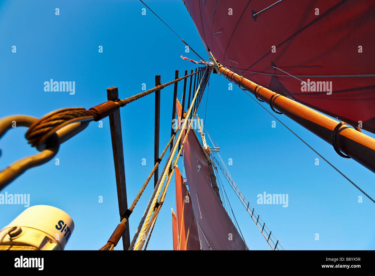 Low angle view of mast and sails on a sailboat Stock Photo - Alamy