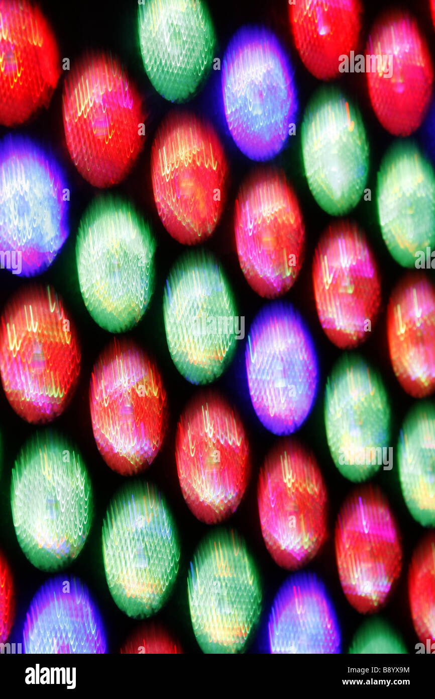 abstract row of many multicoloured flashing colourful fairy lights ...