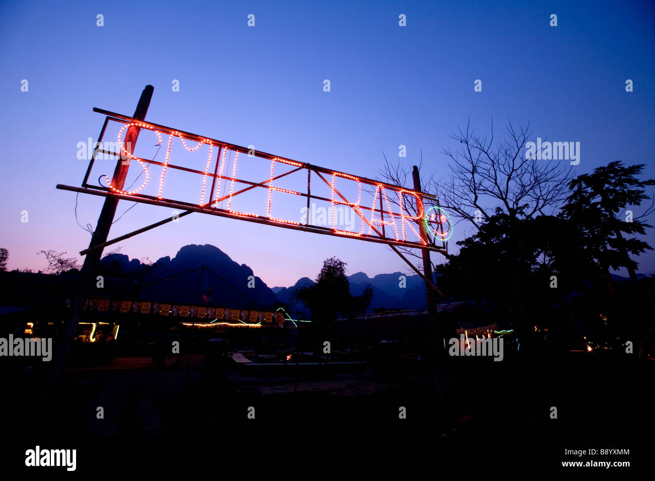 Laos, Vientiane Province, Vang Vieng, local bar, lighted signboard ...