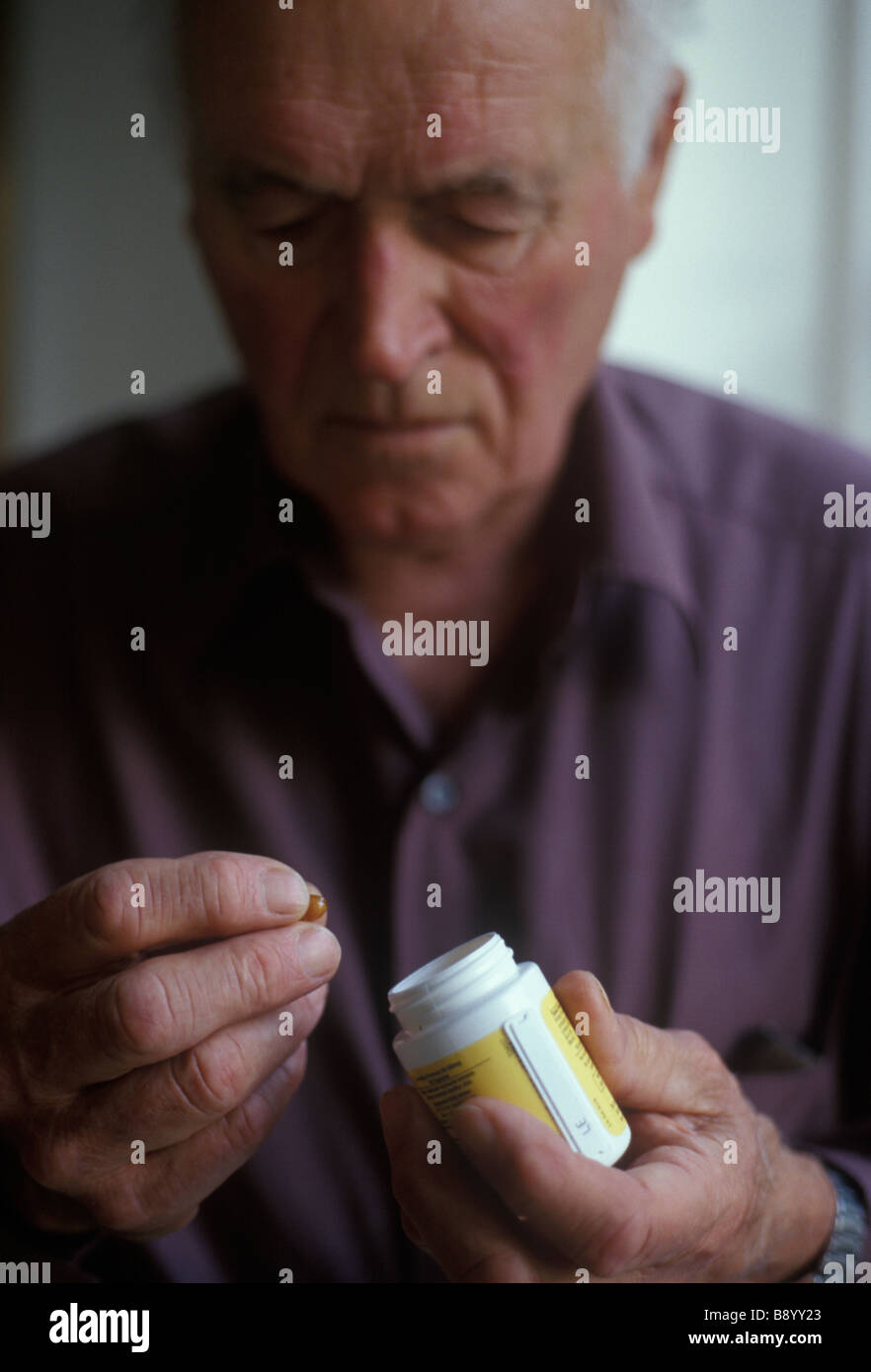 elderly man taking medication Stock Photo - Alamy