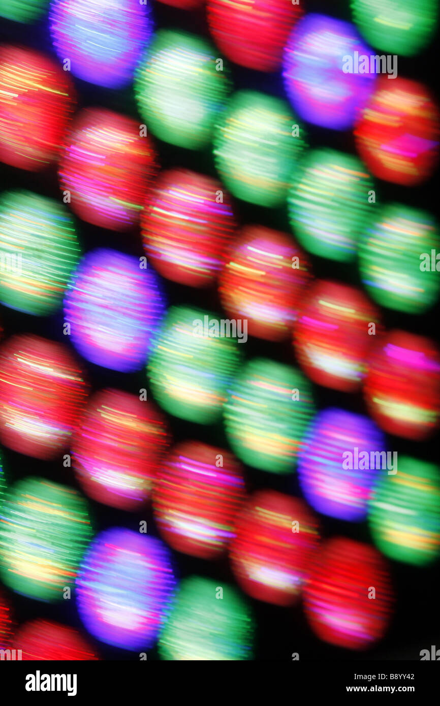 abstract row of many multicoloured flashing colourful fairy lights ...