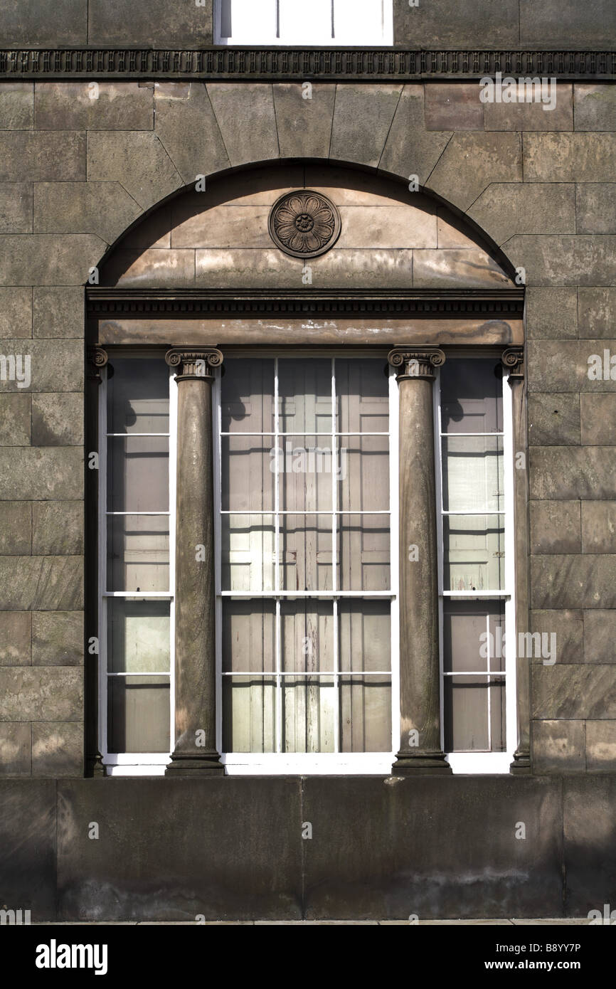 The classical tripartite window with Ionic columns and patera in the ...