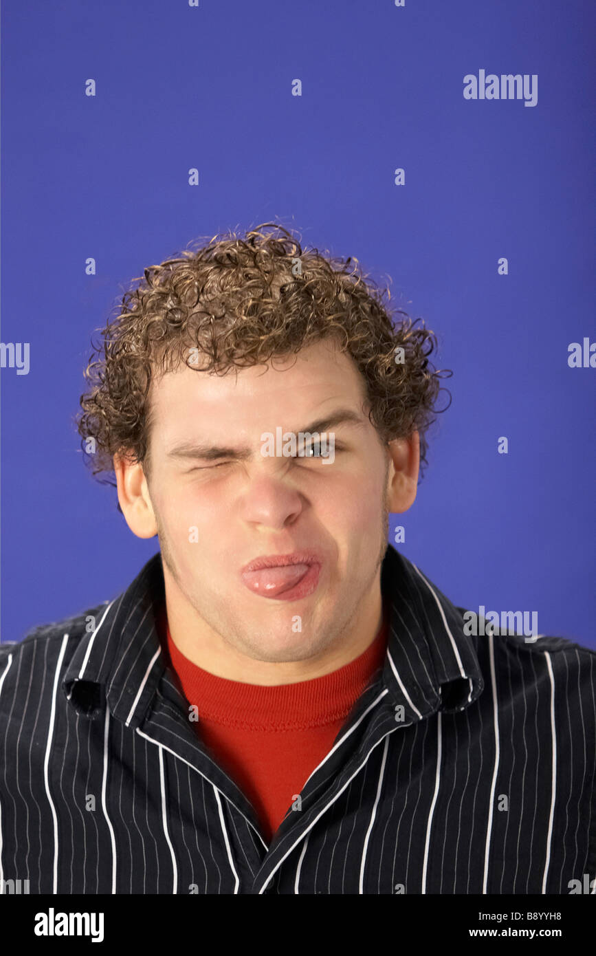 A young man alone making a silly face Stock Photo - Alamy