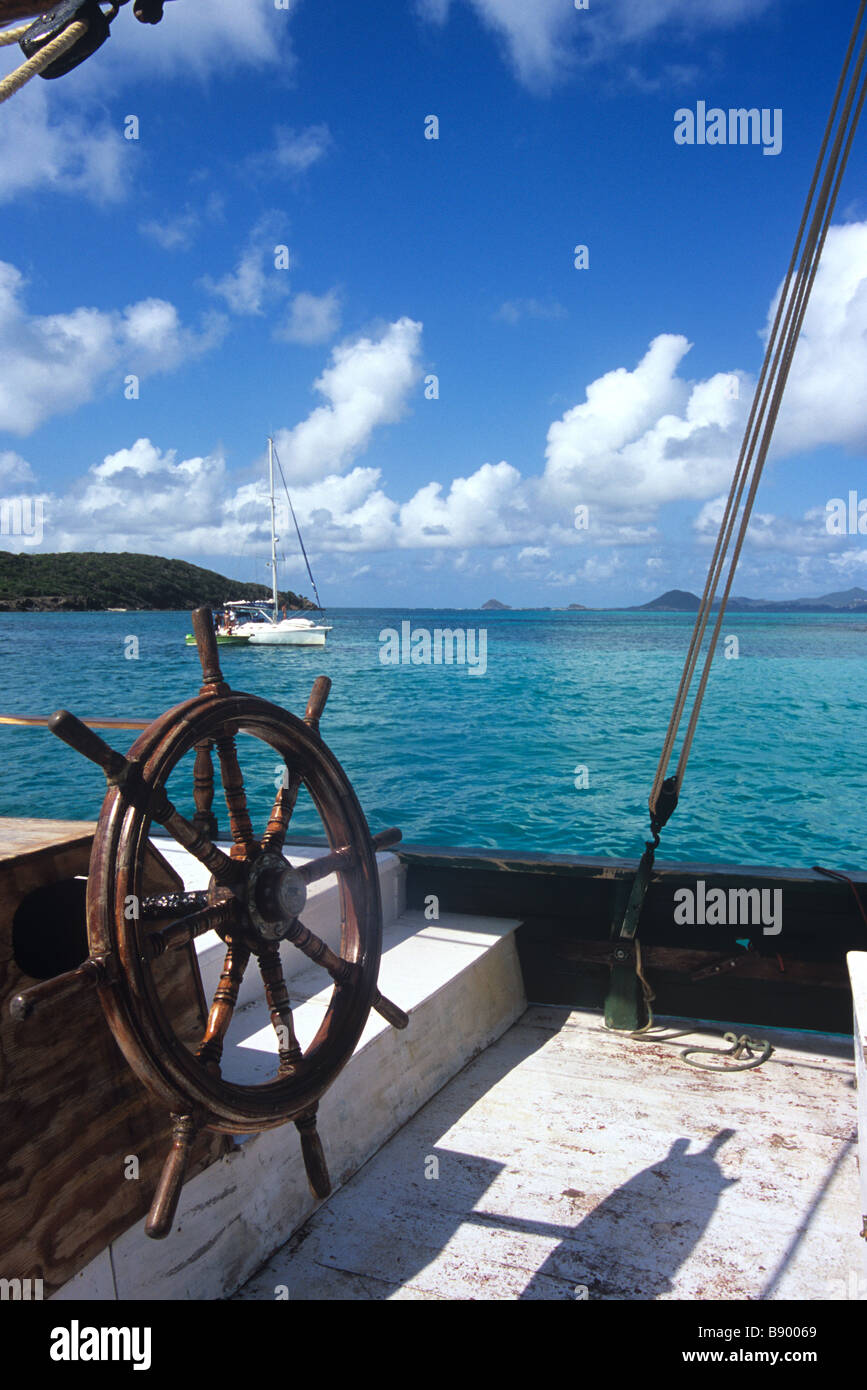 Take the wheel on the deck of this traditional Caribbean Schooner ...