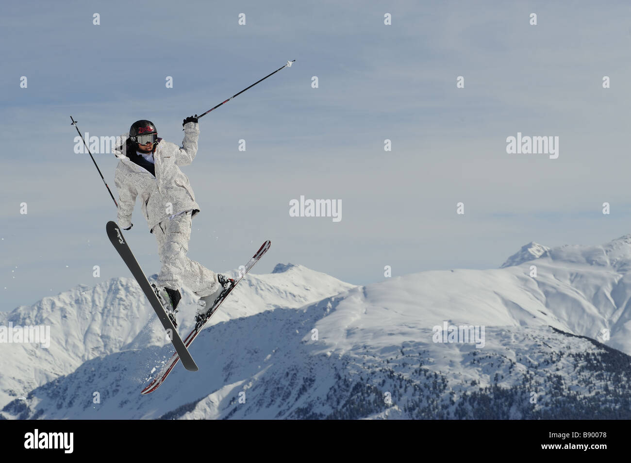Freeskier jumping wildly into the skies in the swiss alps Stock Photo ...