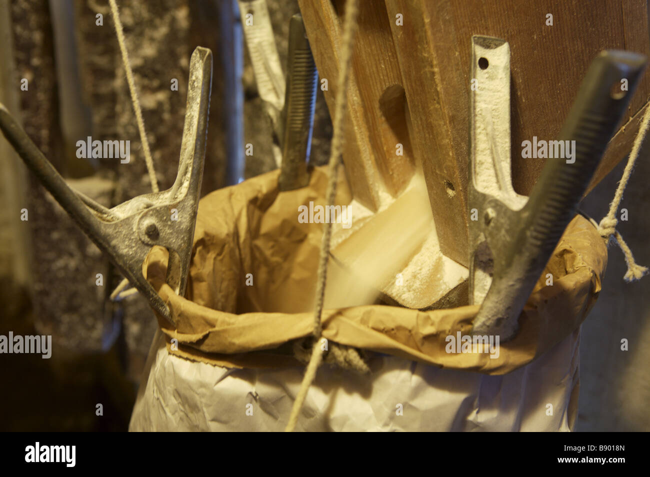Flour being poured into sacks from corn ground at Winchester City Mill ...