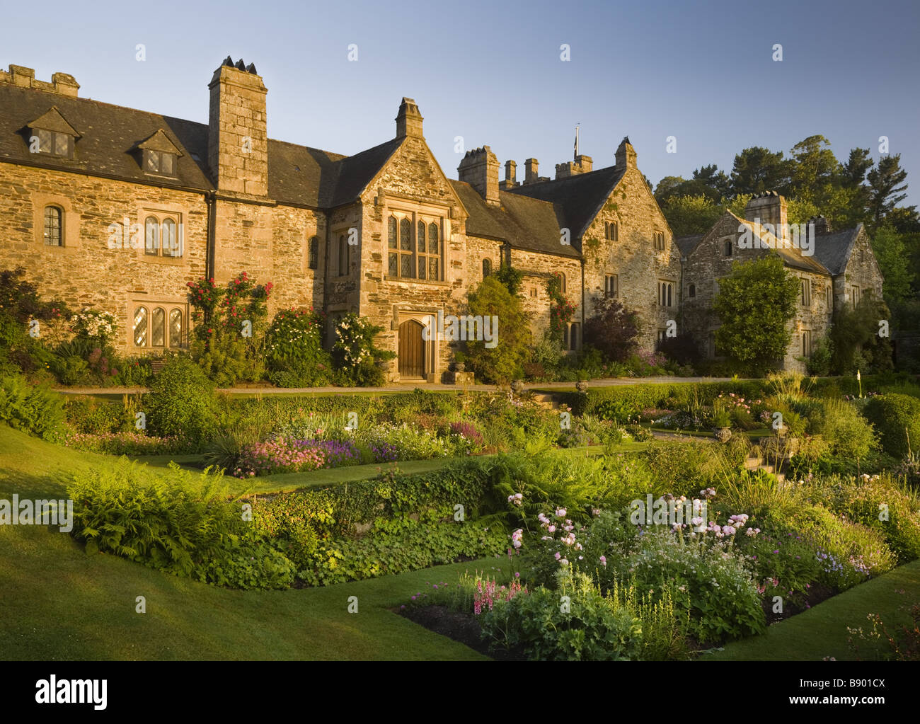 The east front of Cotehele, seen over the East Terrace garden, near ...