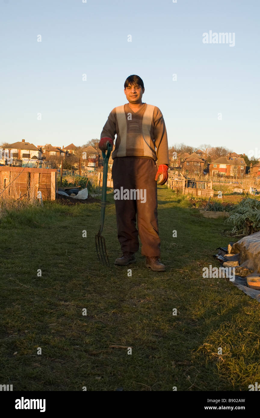 man with fork on allotment Stock Photo - Alamy