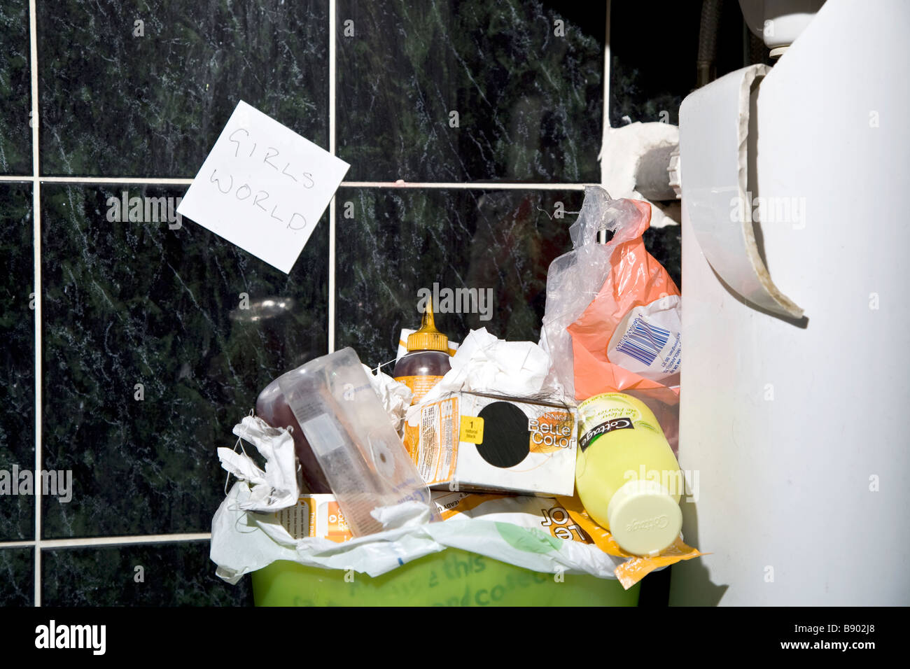 Overflowing bin with female waste Stock Photo - Alamy