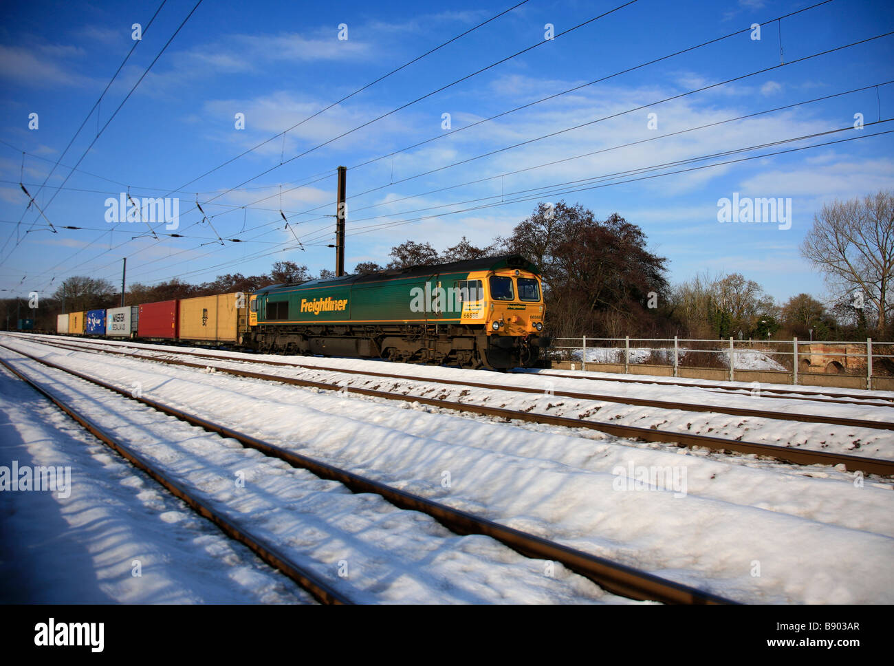 66568 Freightliner with a line of Containers Lolham Level Crossing East ...