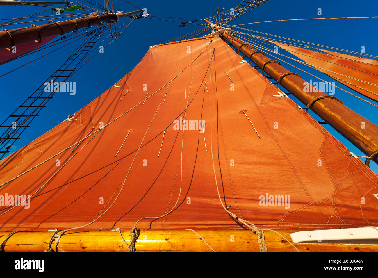 Low angle view of mast and sails on a sailboat Stock Photo - Alamy