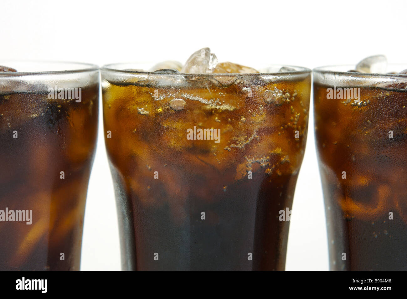 Glasses of cola isolated against a white background Glasses of cola ...