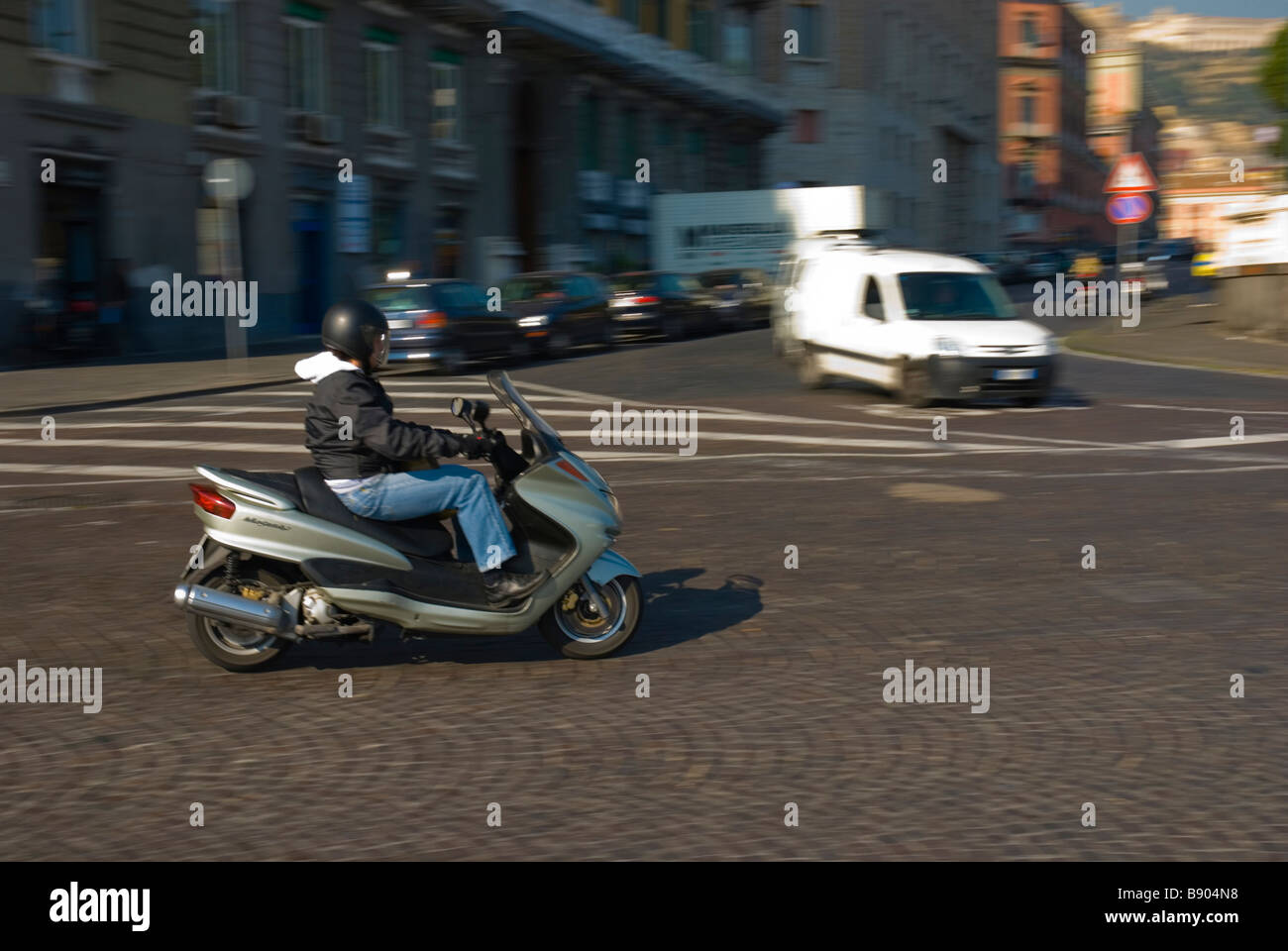 Man riding a moped in Naples Italy Europe Stock Photo - Alamy