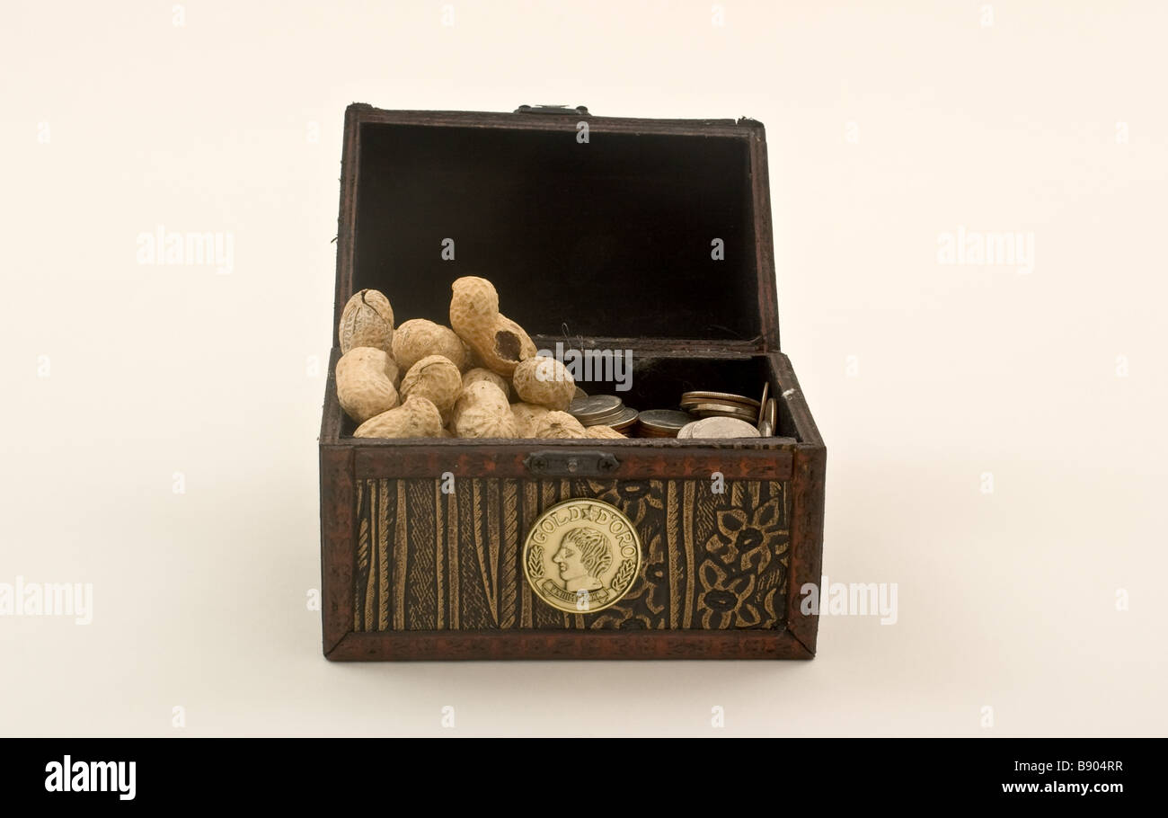 Small treasure chest, half filled with peanuts, half with coins Stock ...