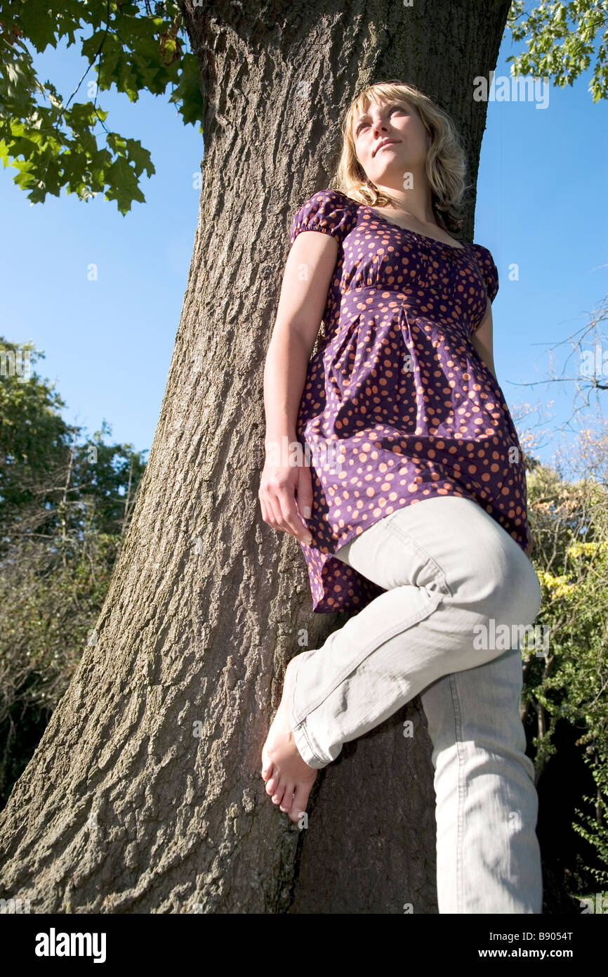 pretty girl at a tree Stock Photo - Alamy