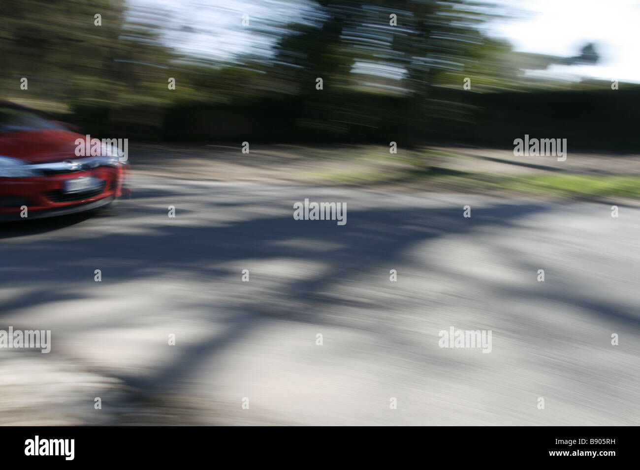 one fast car in motion action on rural country street lane Stock Photo ...
