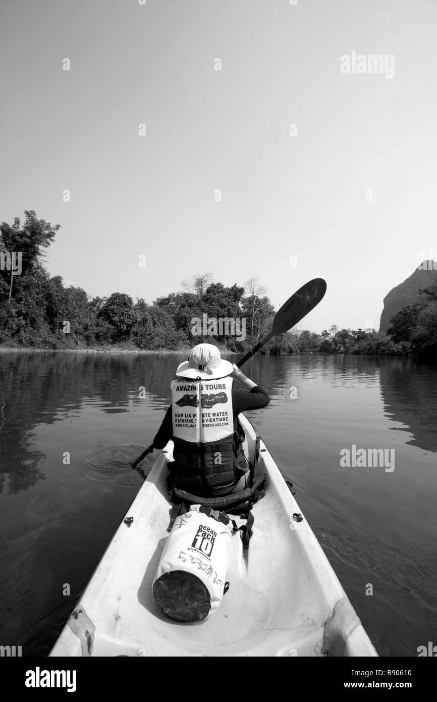 Laos, Vientiane Province, Vang Vieng, Nam Song River, kayak, woman ...