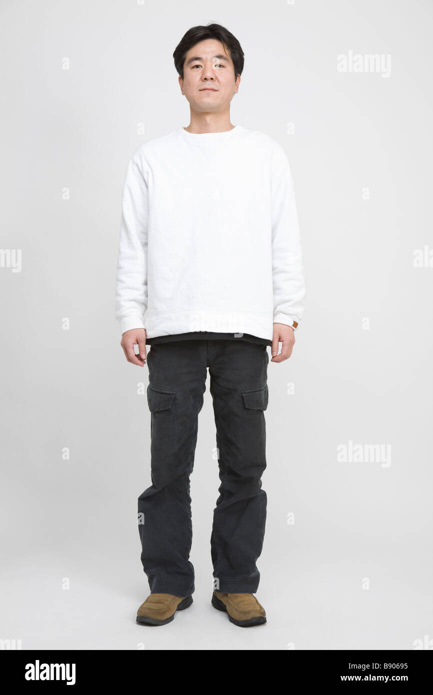 Portrait of a mid adult man standing Stock Photo - Alamy