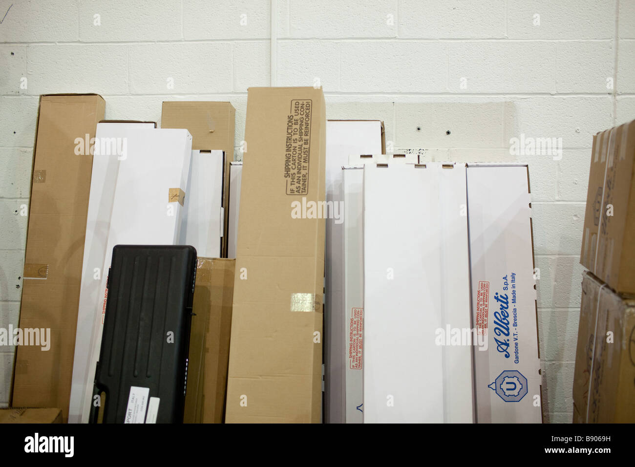 Boxes with guns and firearms await to be opened and sold at a gun show ...