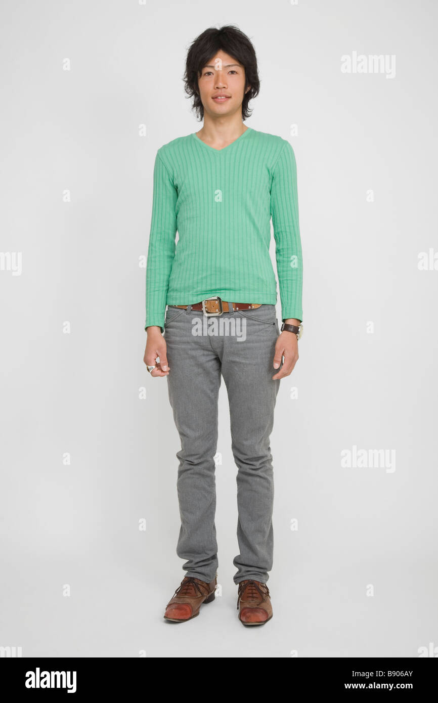 Portrait of a young man standing Stock Photo - Alamy