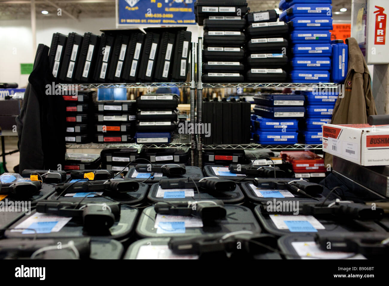 Guns are displayed on a vendors table for sale at a gun show in ...