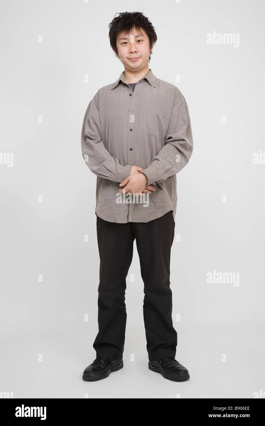 Portrait of a mid adult man standing Stock Photo - Alamy