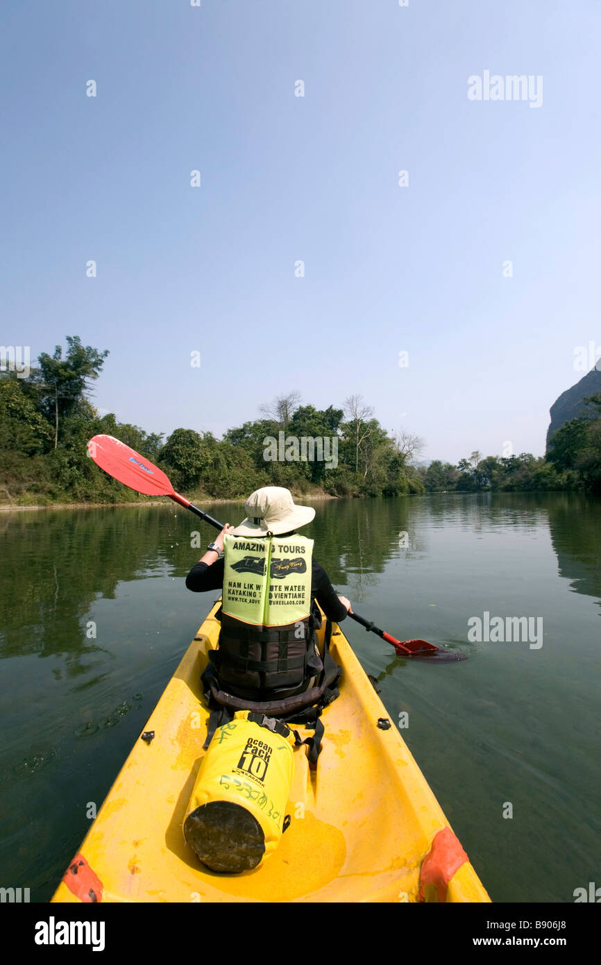 Laos, Vientiane Province, Vang Vieng, Nam Song River, kayak, woman ...