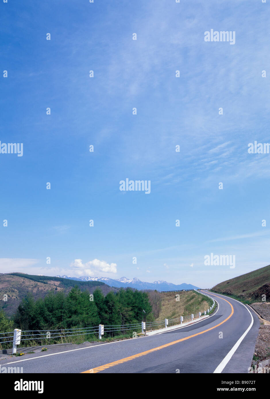 Left curve road through mountain Stock Photo - Alamy