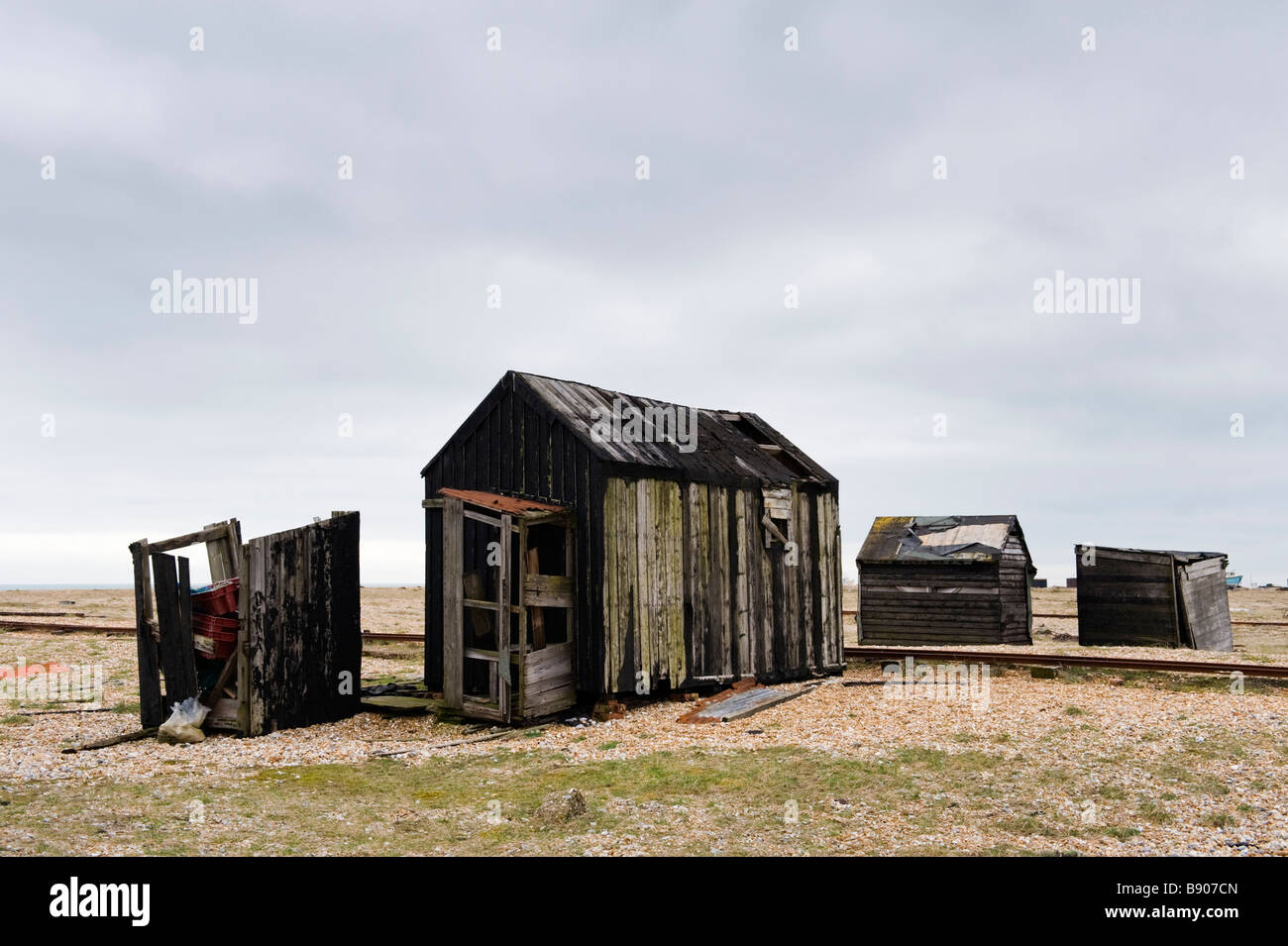 Disused sheds shacks and huts on shingle at Dungeness in Kent Stock ...