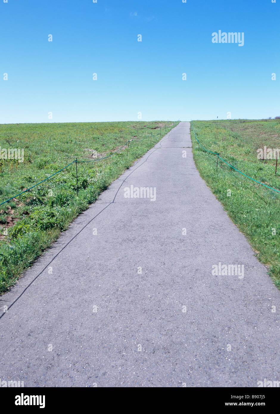 Path and blue sky Stock Photo - Alamy