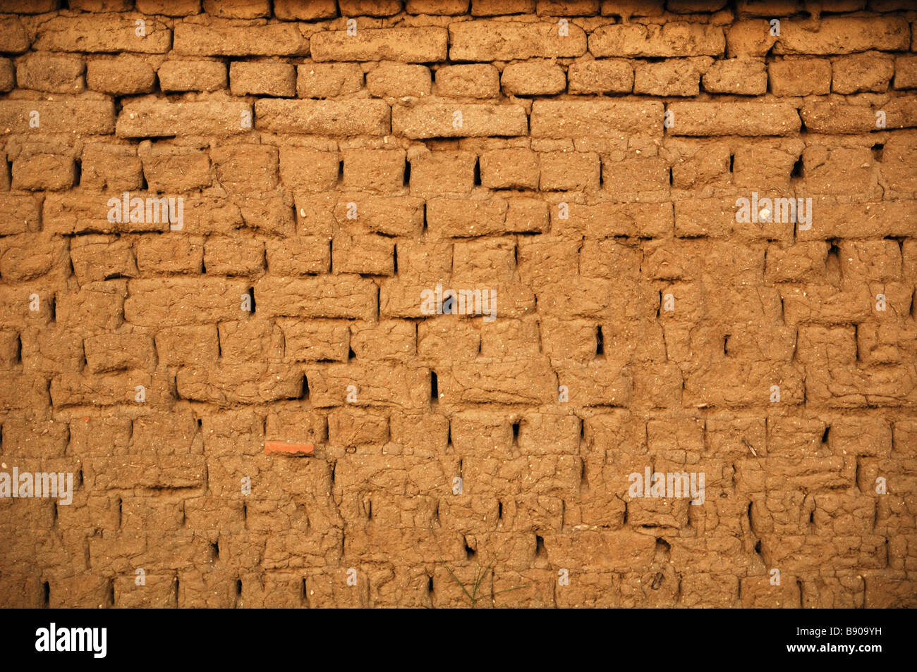 Background wall made of mud bricks Stock Photo - Alamy