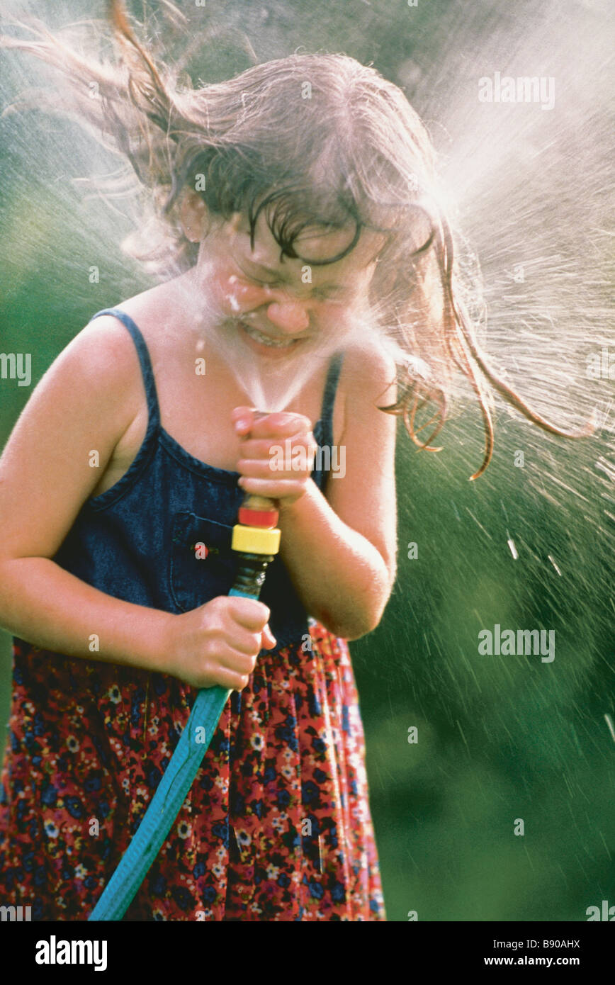 FL0872, D Wiggett; Girl Spraying Face Hose Stock Photo - Alamy