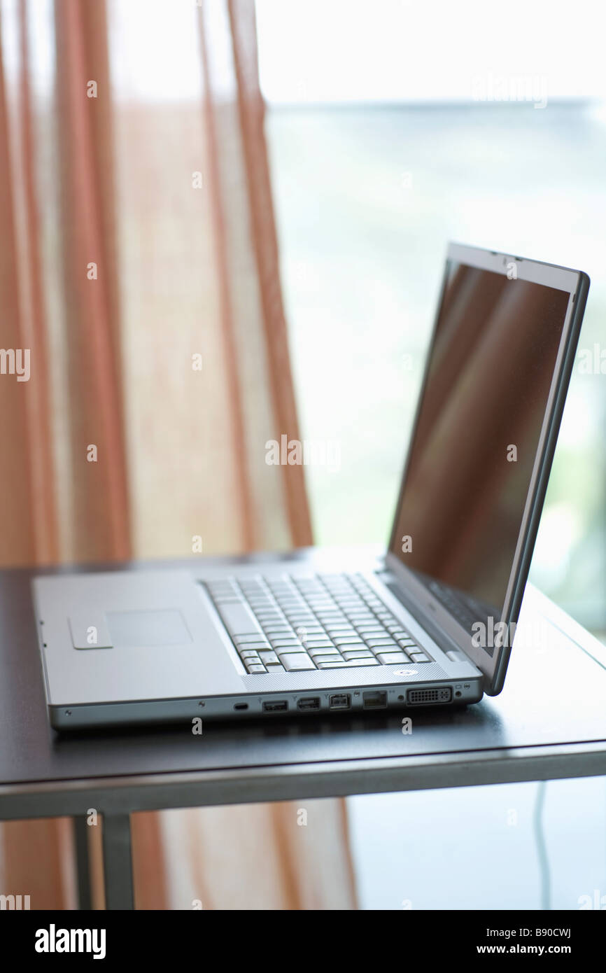 A laptop by a window Stock Photo - Alamy