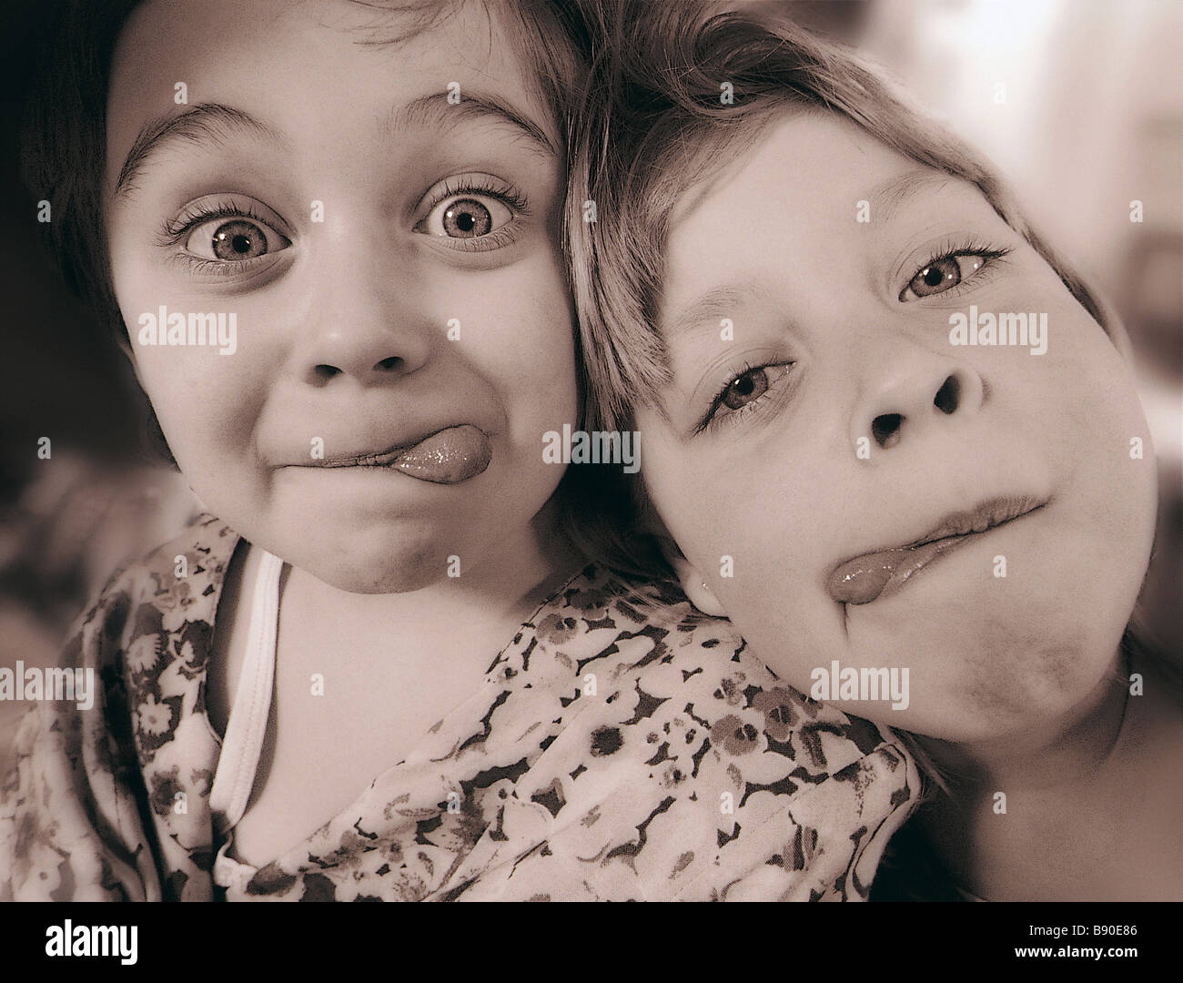 Two girls sticking tongues out hi-res stock photography and images - Alamy