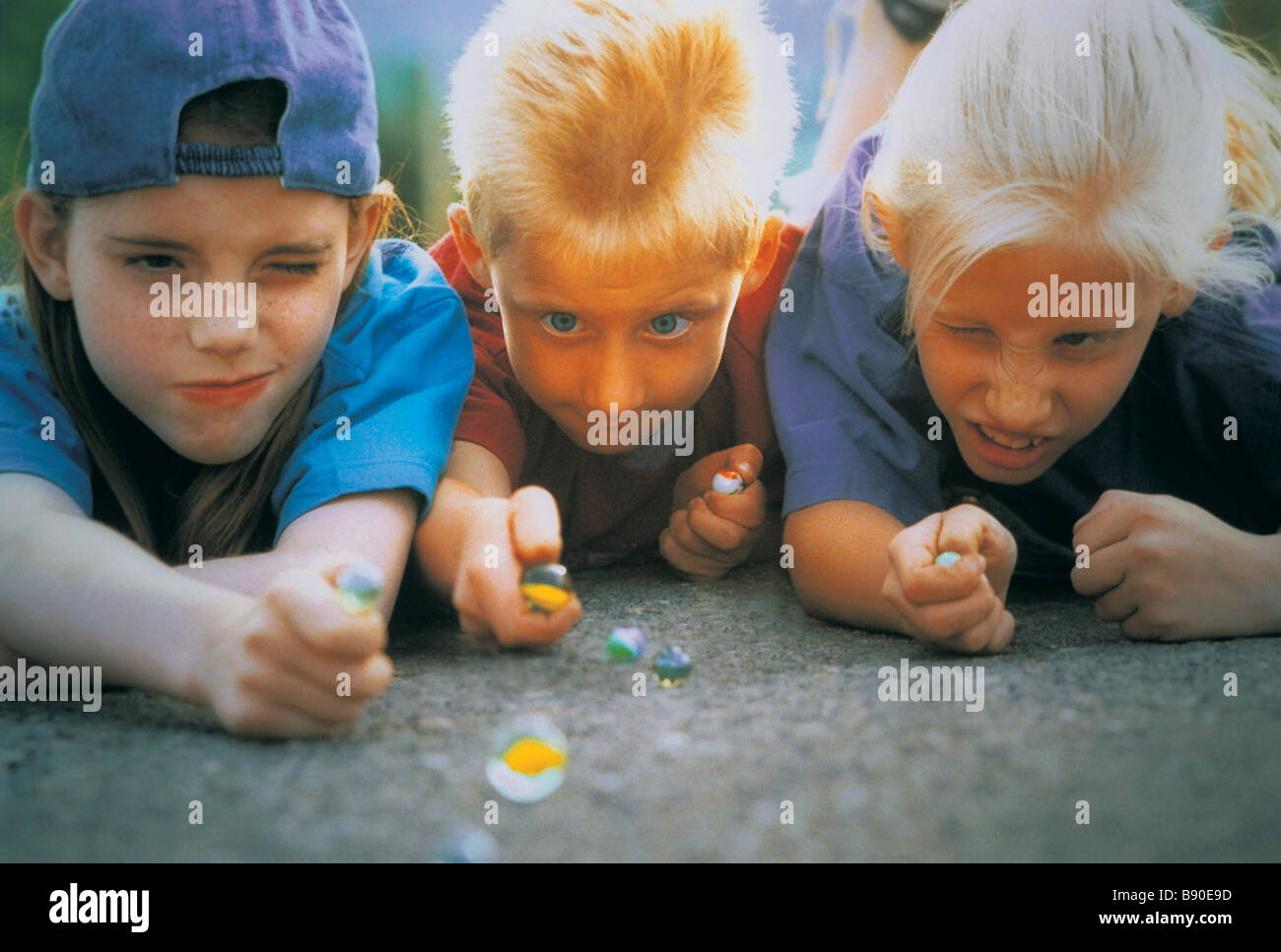 Boys outdoors playing marbles hi-res stock photography and images - Alamy