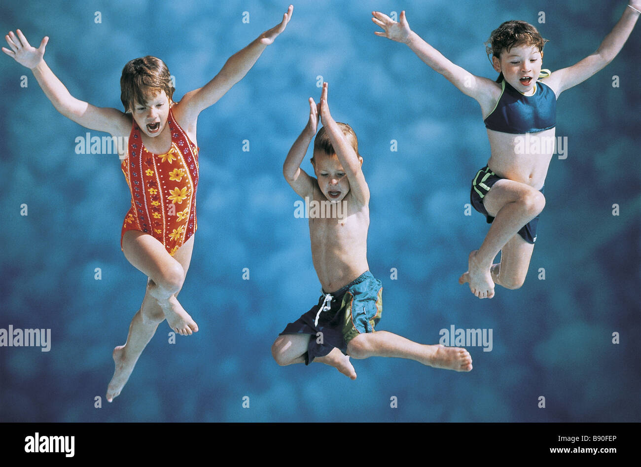 Three people jumping swimming pool hi-res stock photography and images ...
