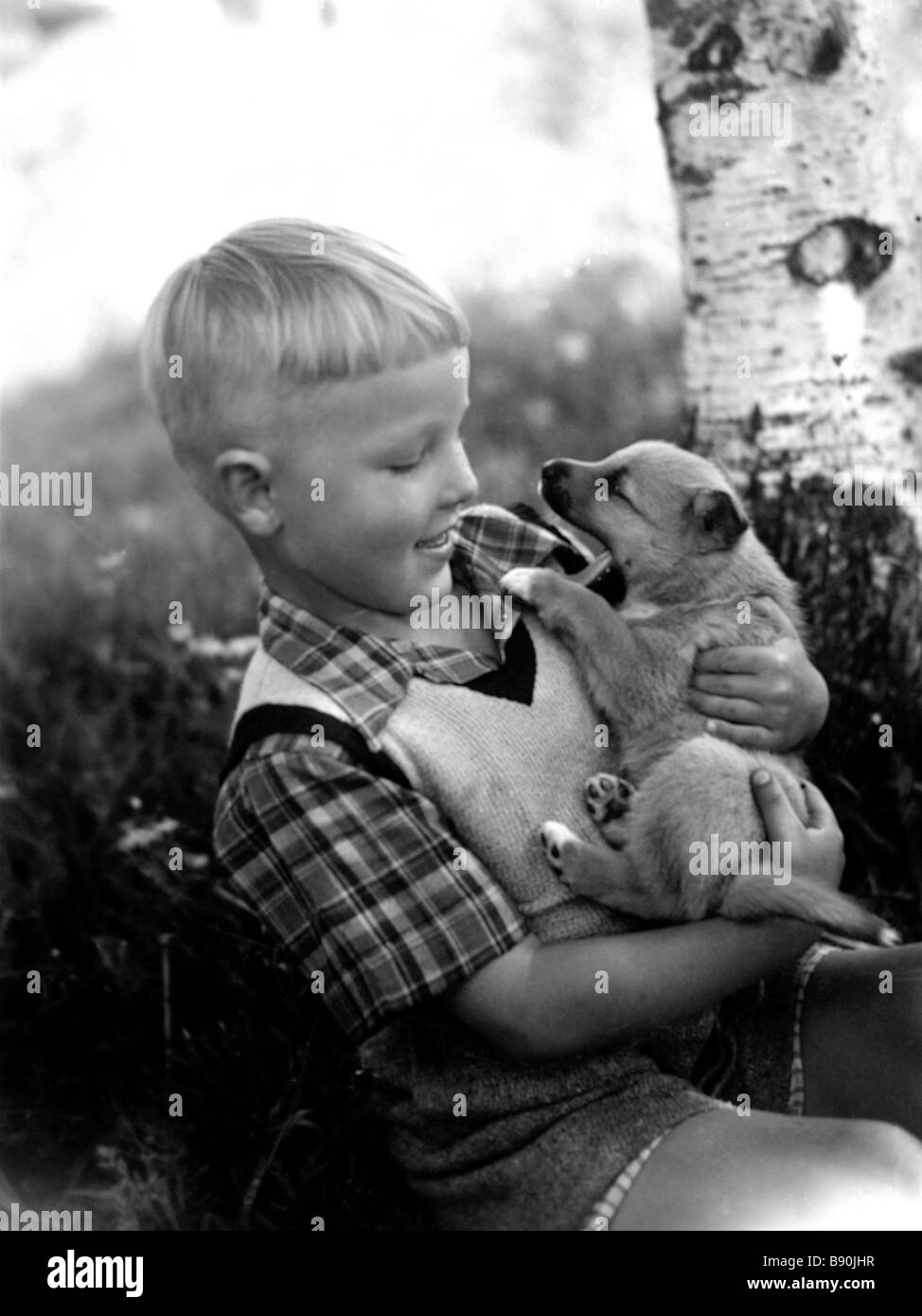Boys cuddling Black and White Stock Photos & Images - Alamy