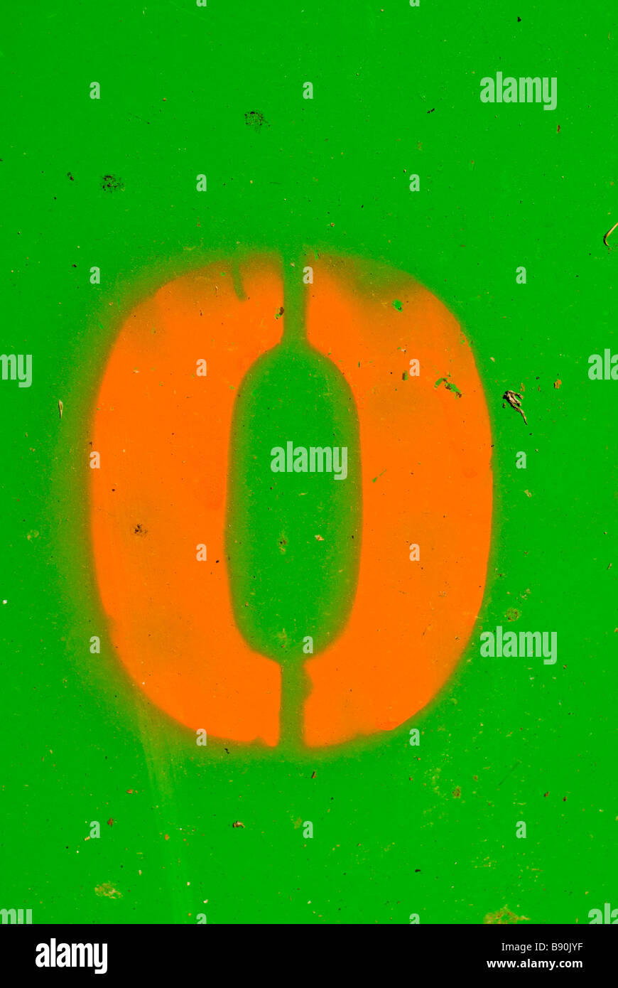 An orange number 0 stencilled on a green painted background Stock Photo ...