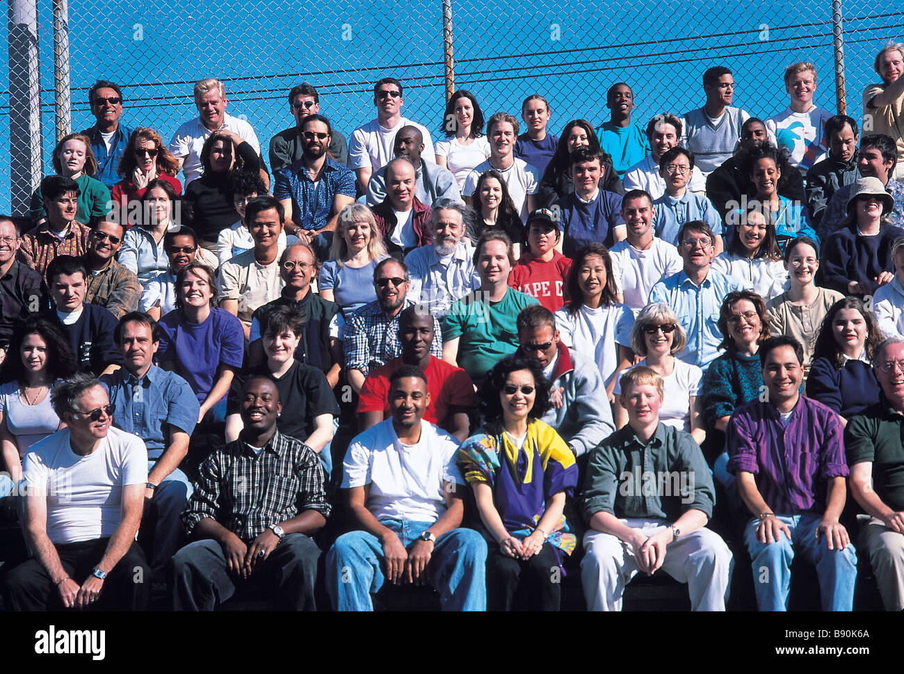 FL3466, FIRST LIGHT; Sitting smiling crowd Stock Photo - Alamy