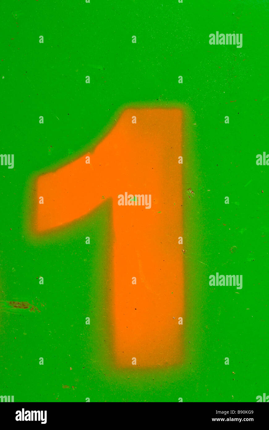 An orange number 1 stencilled on a green painted background Stock Photo ...