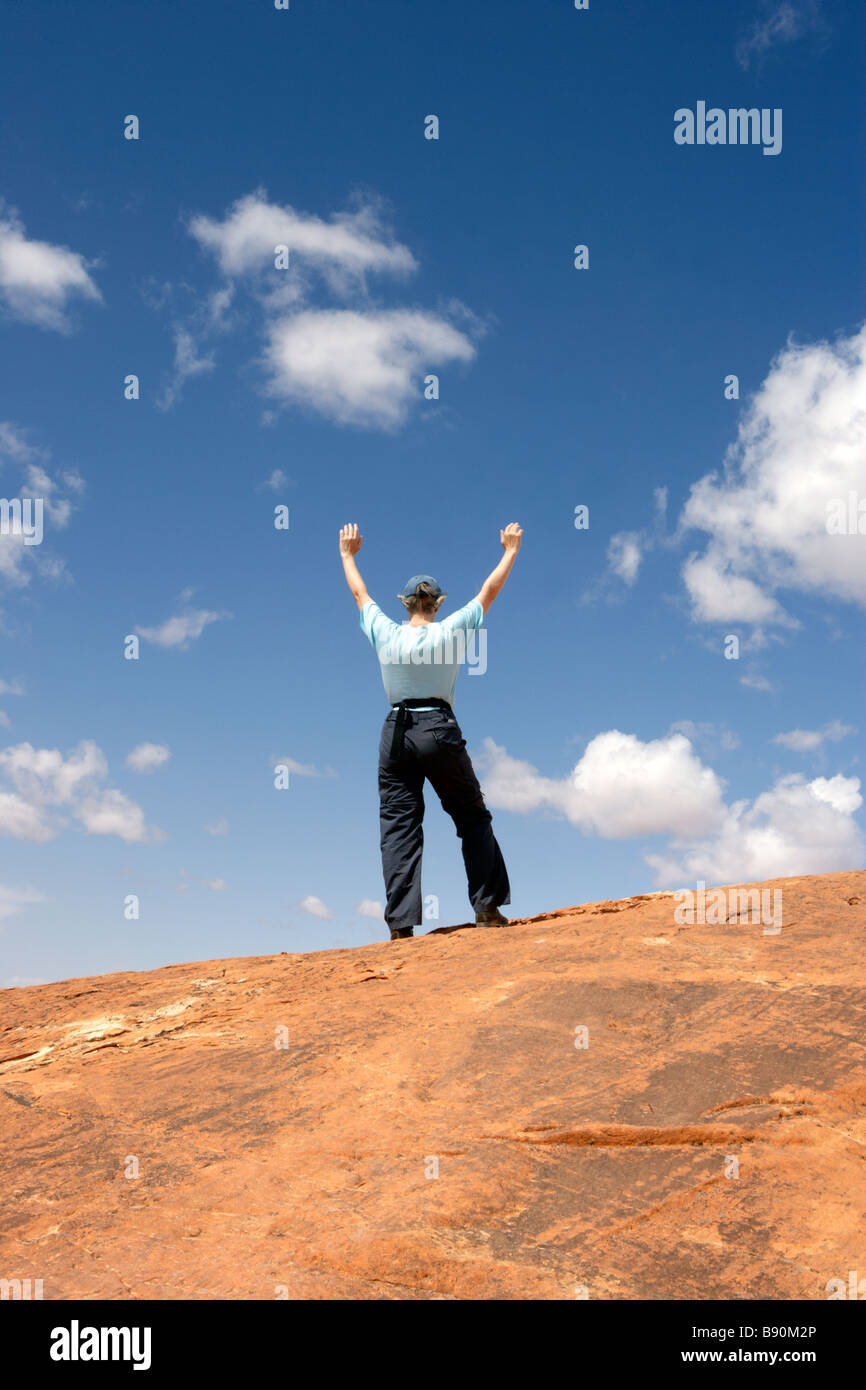 Person on Top of Sandstone Hill Stock Photo - Alamy