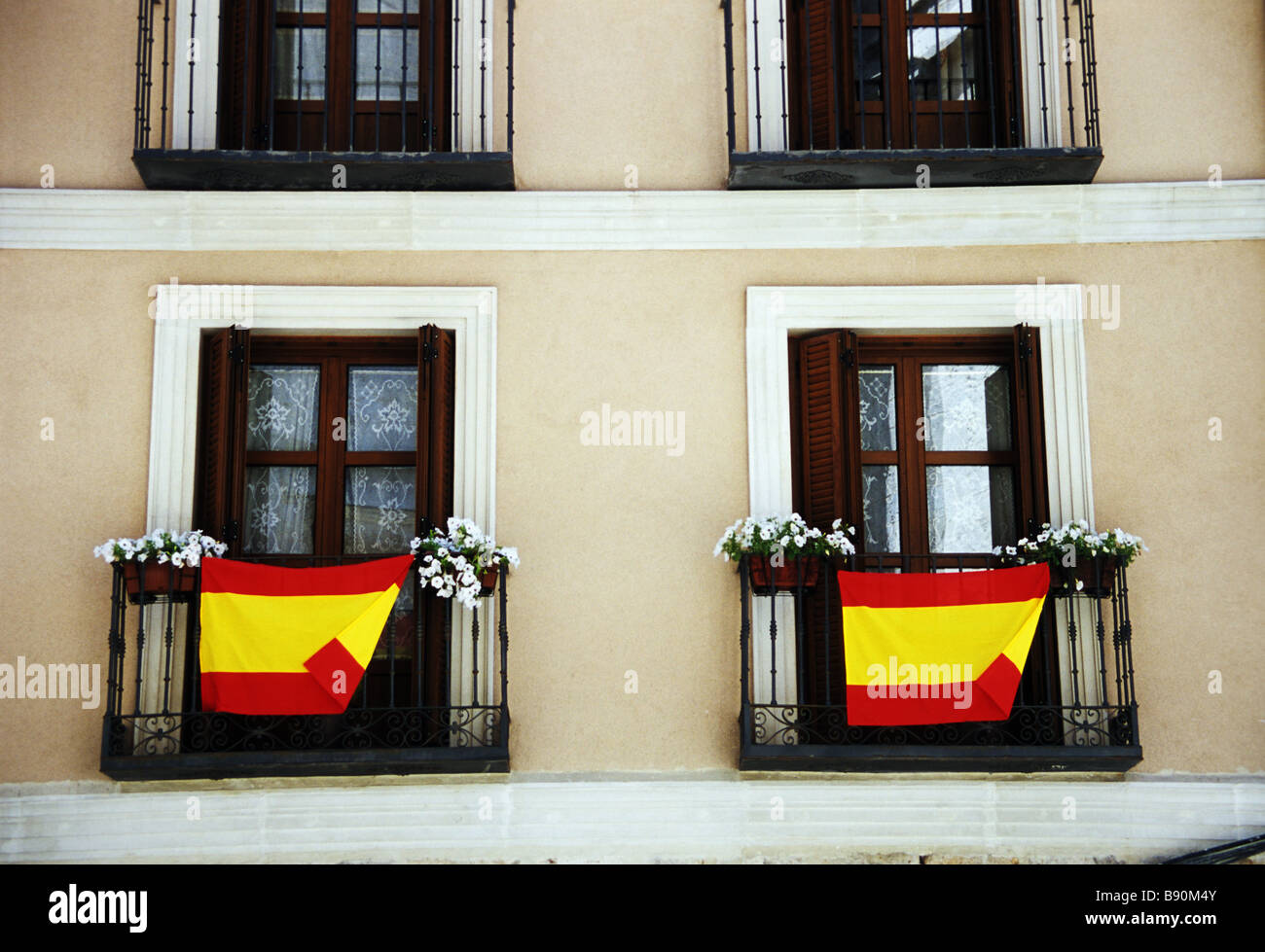 Windows are decorated with Spanish flags on festival day in Valladolid ...