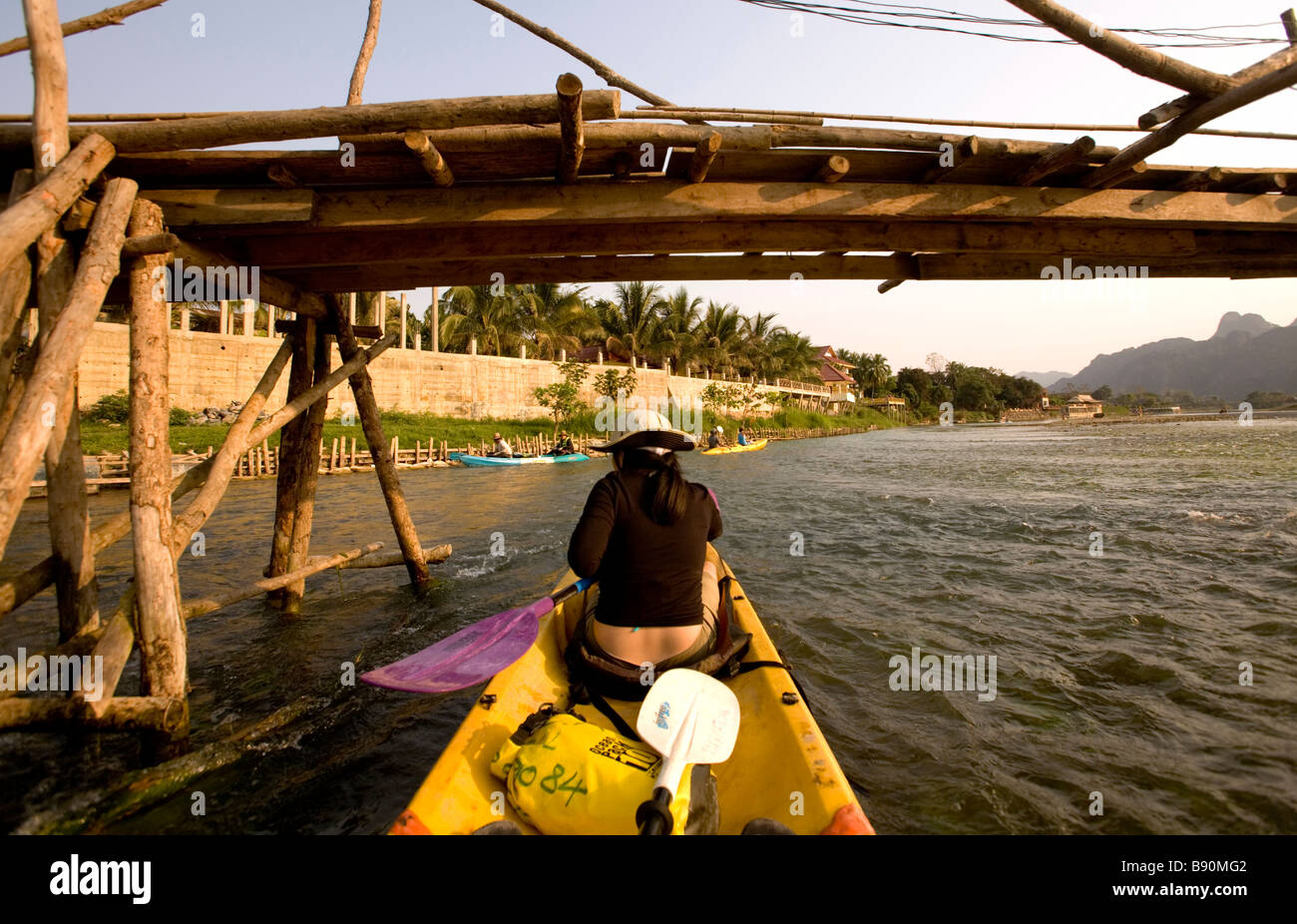Laos, Vientiane Province, Vang Vieng, Nam Song River, kayak, woman ...