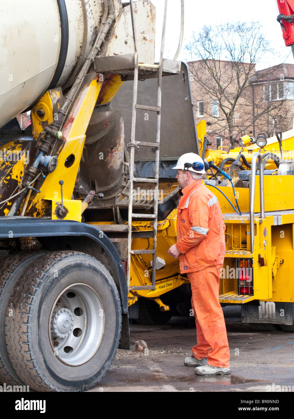 worker delivering cement Stock Photo - Alamy